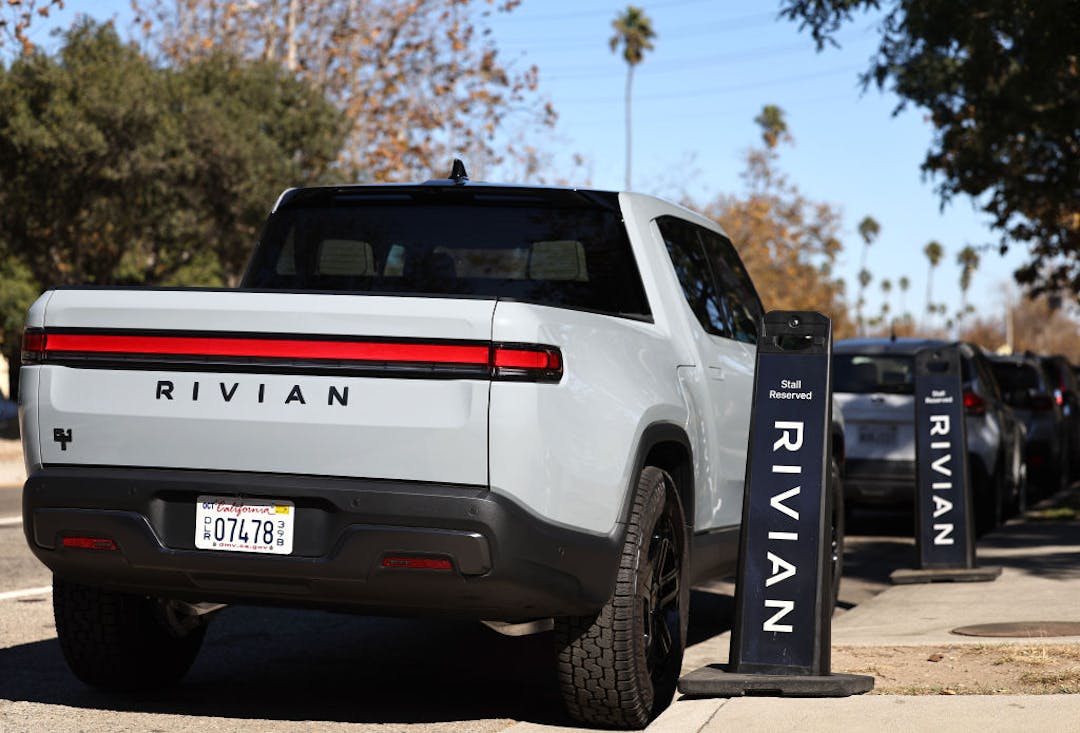 Rivian climbs after-hours as it beats on top and bottom lines ...
